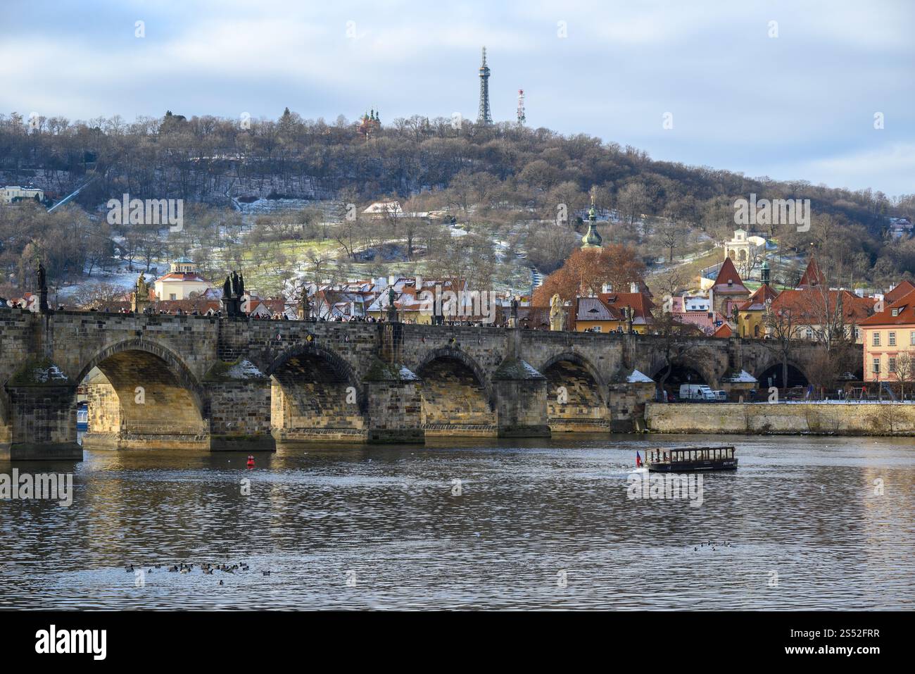 View of the famous Charles Bridge over Vltava river in winter, in ...