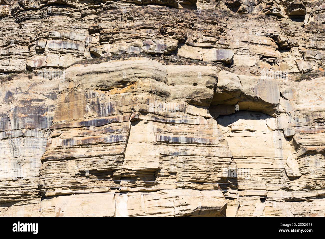travel to North Caucasus region region - old layered rock in Caucasus ...
