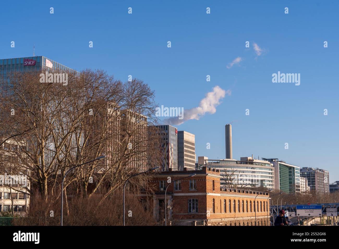 Industrial skyline with smoke rising over buildings in a city Stock ...