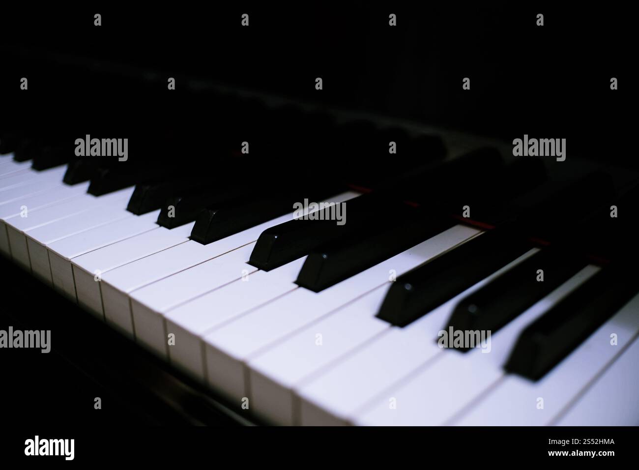 Piano keyboard background with selective focus Stock Photo - Alamy