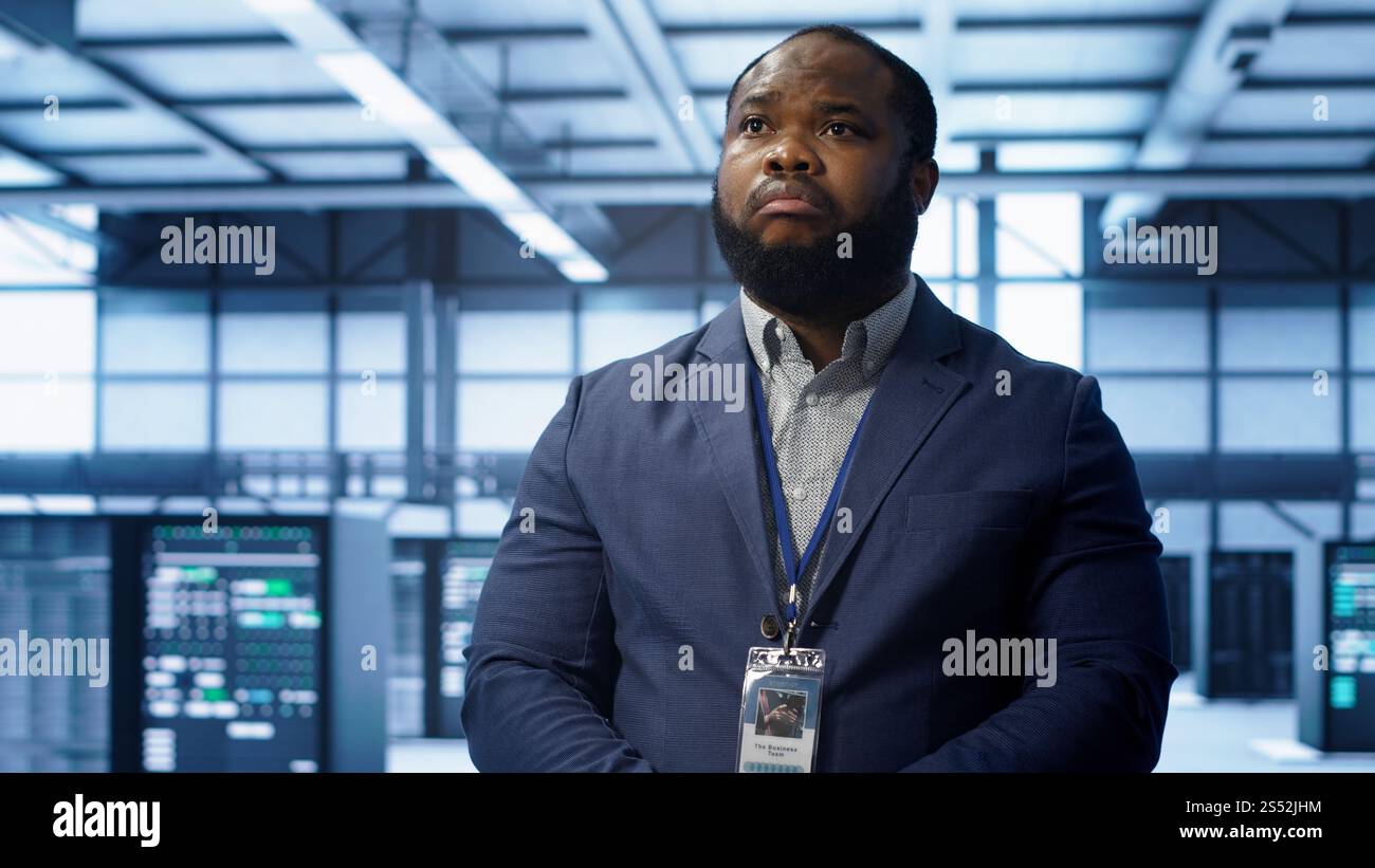 IT expert managing data center with advanced technology, ensuring cybersecurity and efficient ...