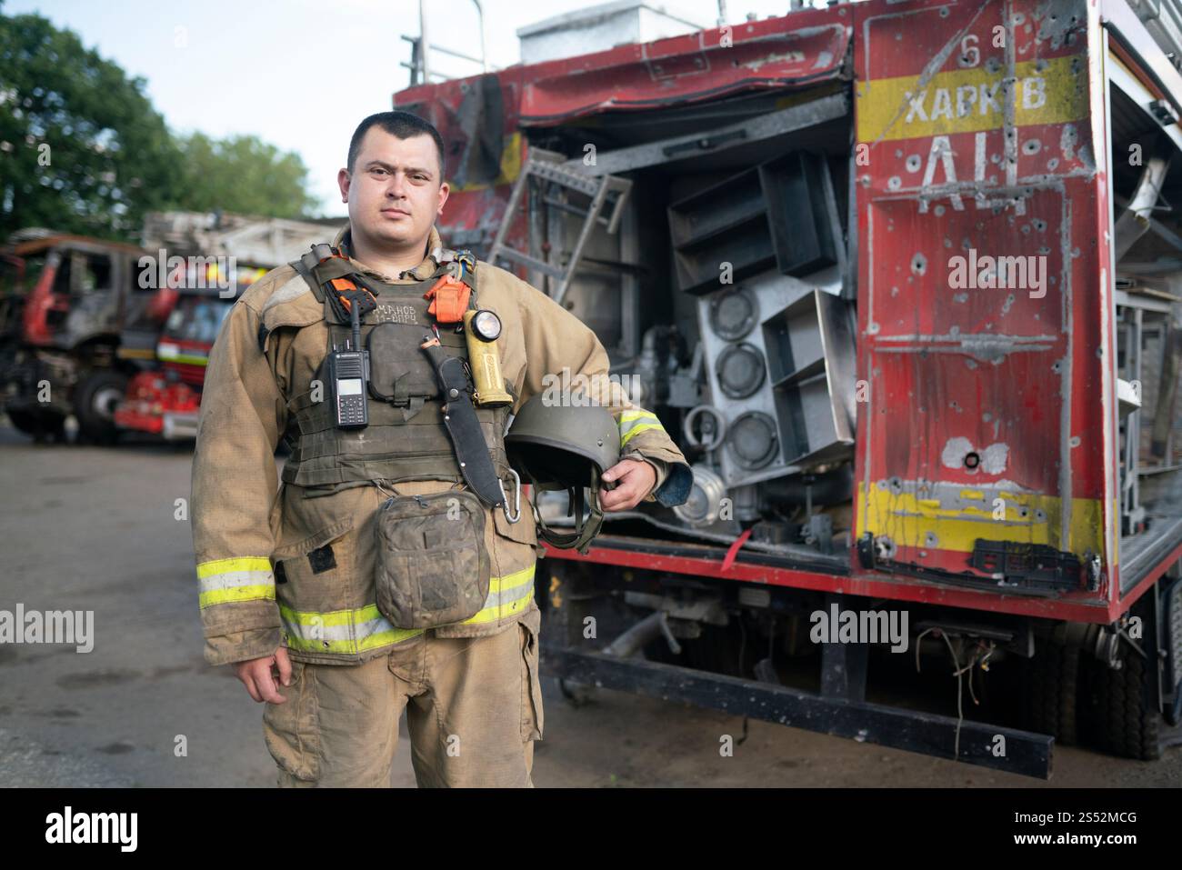 Ukrainian firefighter Roman Kachanov in front of destroyed Ukrainian ...