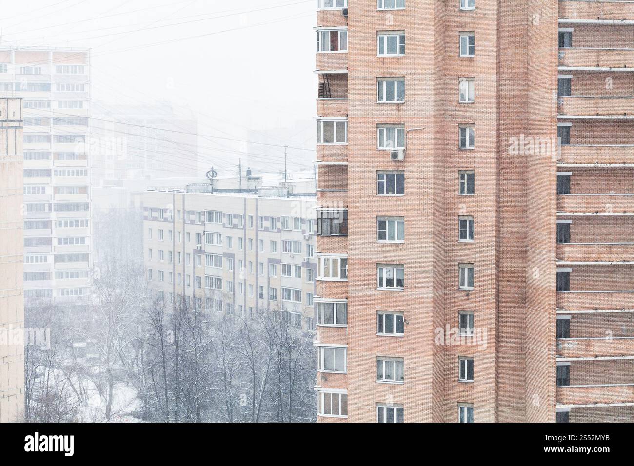 snowfall in residential district of Moscow city in cold wither day ...