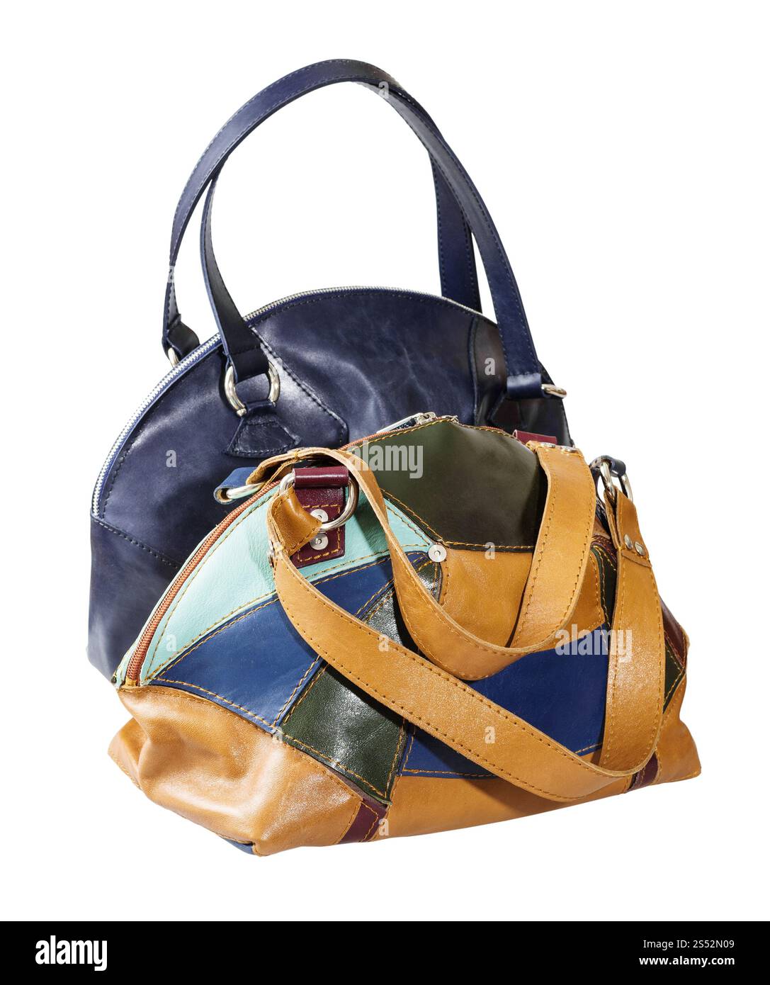 side view of two handmade leather handbags isolated on white background ...