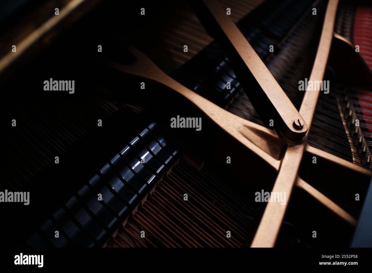 internal parts of an upright piano strings and a tuning key on the pins Stock Photo - Alamy
