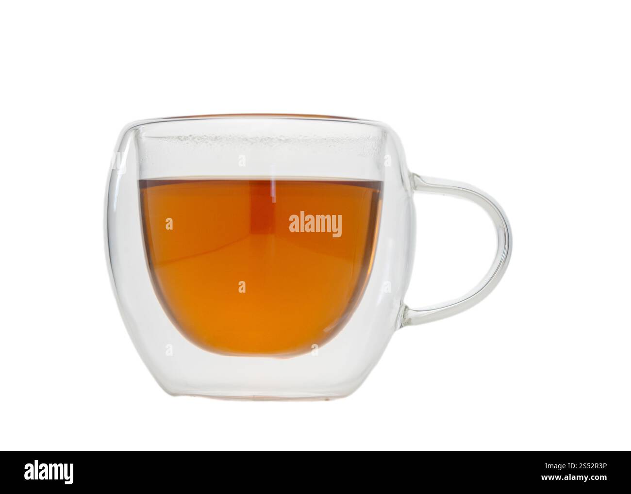 A clear glass mug holds a soothing cup of herbal tea, inviting ...