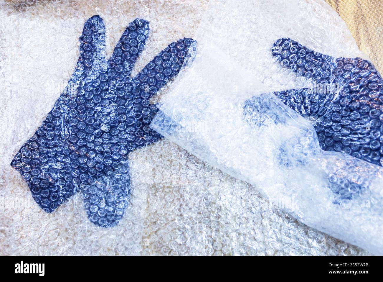 workshop of hand making a fleece gloves from blue Merino sheep wool ...