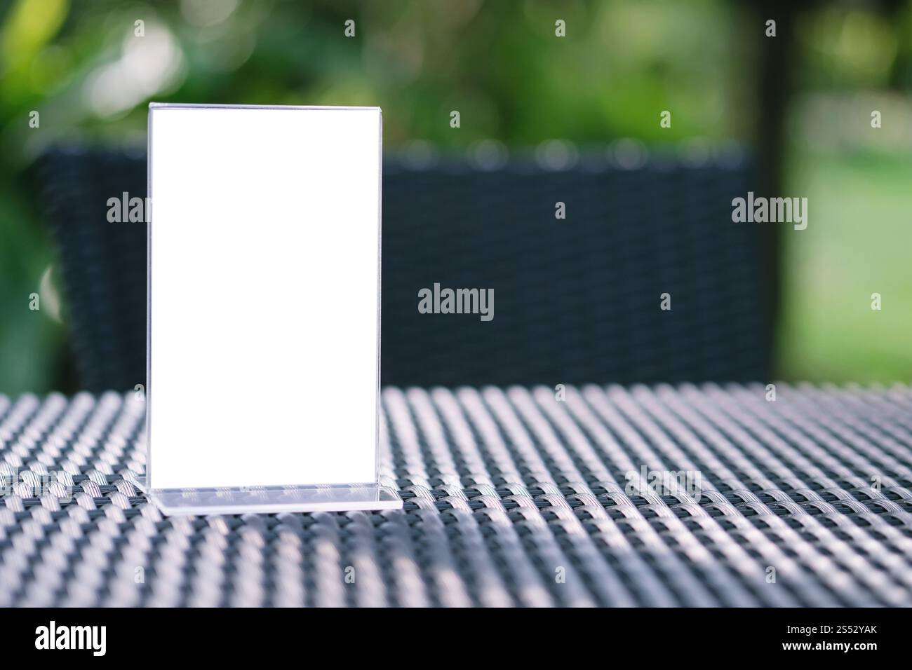 Menu frame standing on wood table in Bar restaurant cafe. space for ...