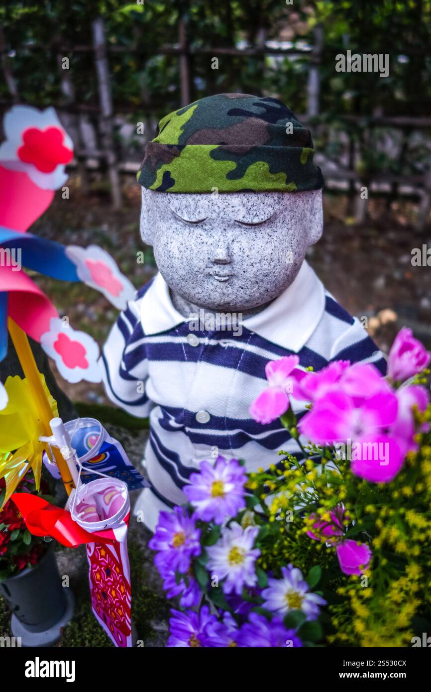 Jizo statue at Zojo-ji temple cemetery, Tokyo, Japan. Jizo statue at ...