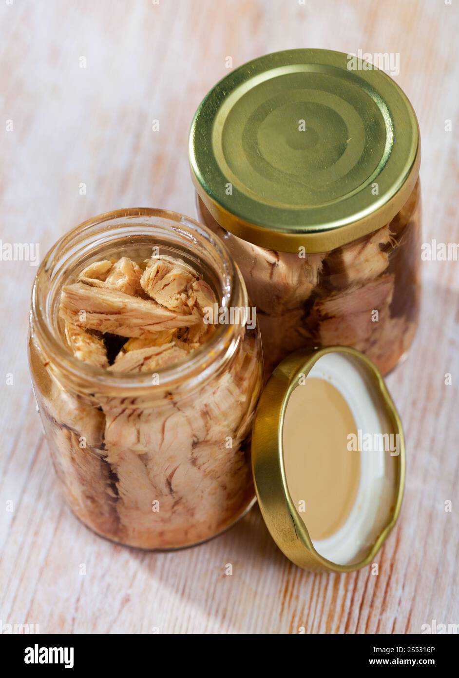 Glass jar with canned tuna in oil Stock Photo - Alamy