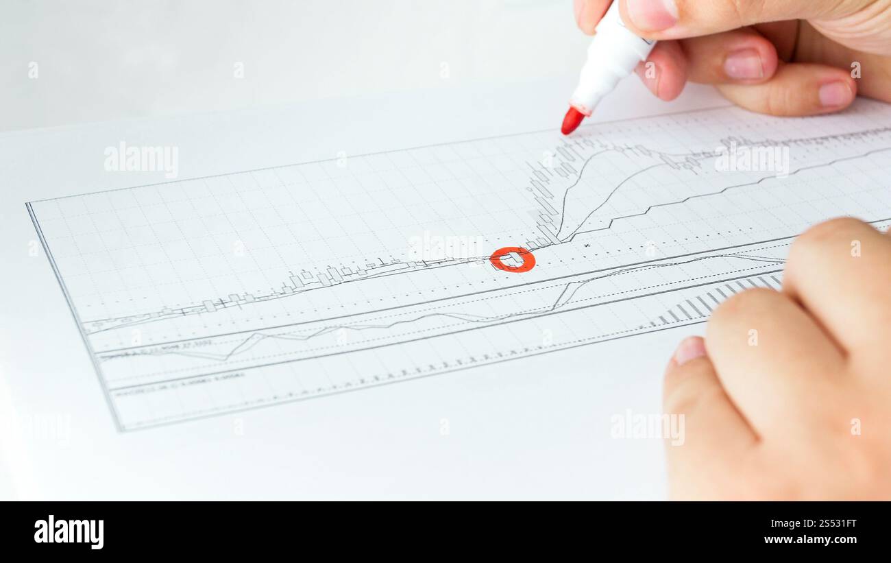 Closeup photo of businessman marking important points of financial ...