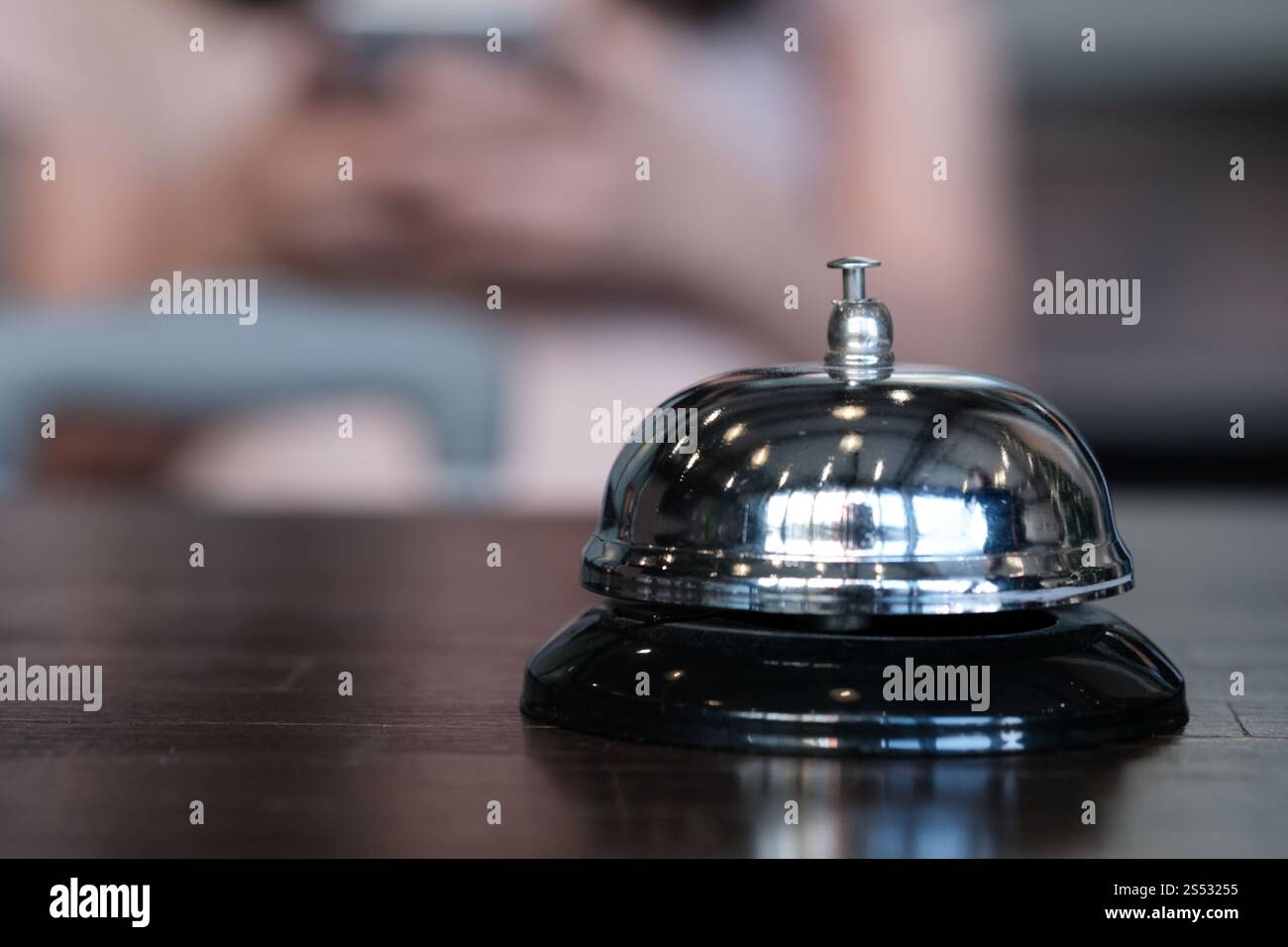 Hotel reception counter desk with service bell Stock Photo - Alamy