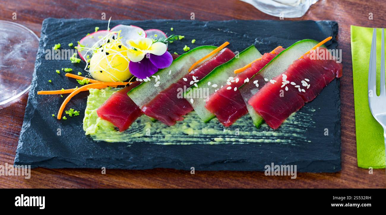 Tuna sashimi with cucumber and avocado sauce Stock Photo - Alamy