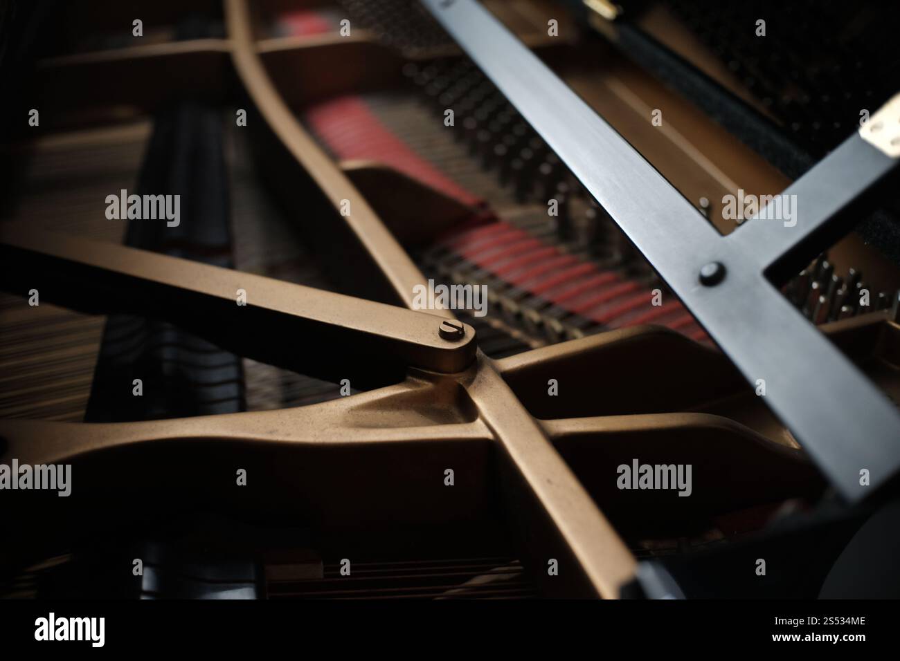 internal parts of an upright piano strings and a tuning key on the pins Stock Photo - Alamy