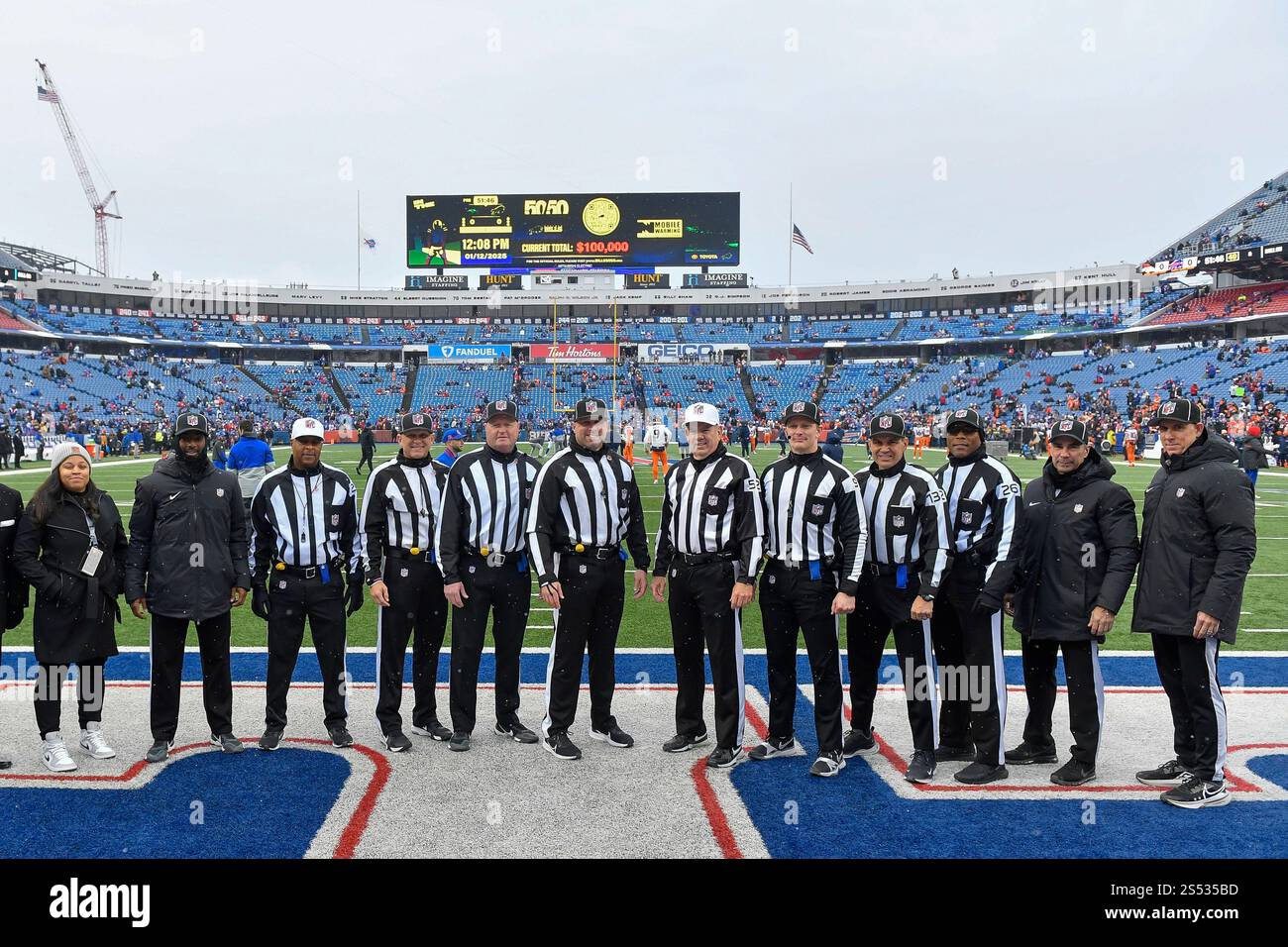Uniformed officials, from third from left, referee Adrian Hill, back ...