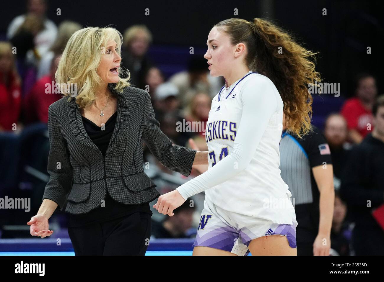 Washington head coach Tina Langley talks with guard Elle Ladine during ...