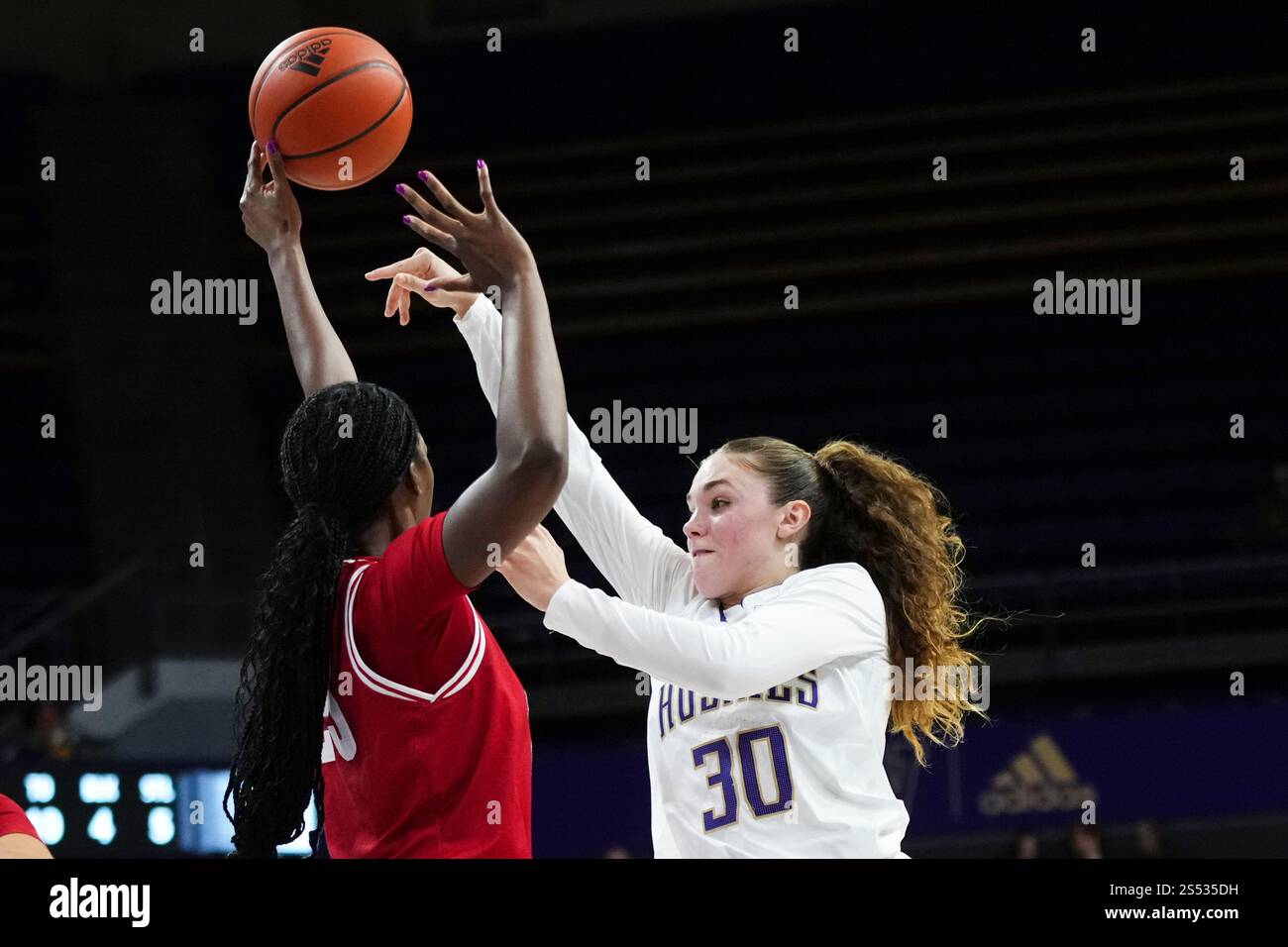Wisconsin forward Serah Williams, left, tips the ball away from ...