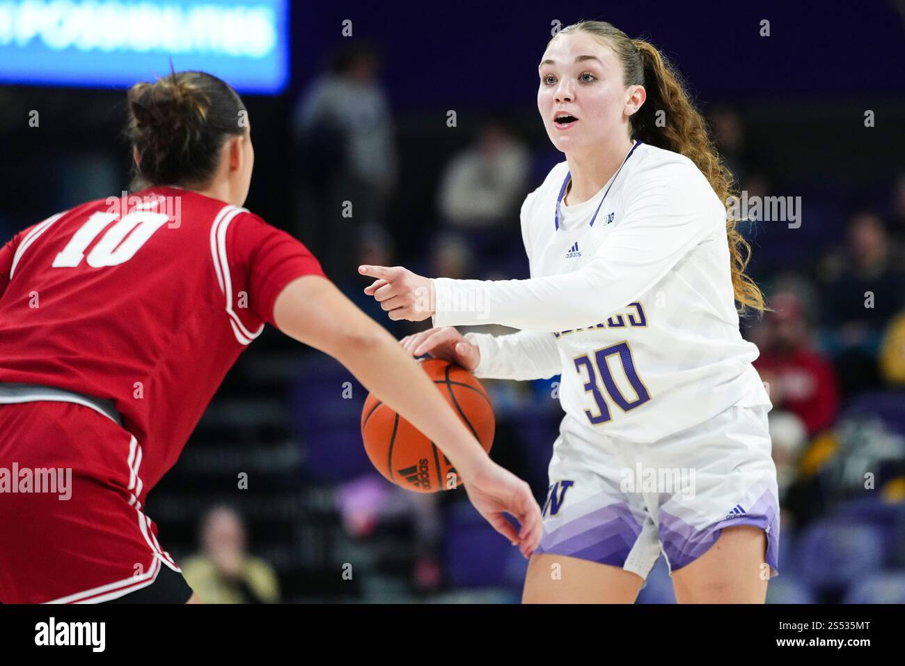 Washington guard Elle Ladine in action against Wisconsin guard Halle ...