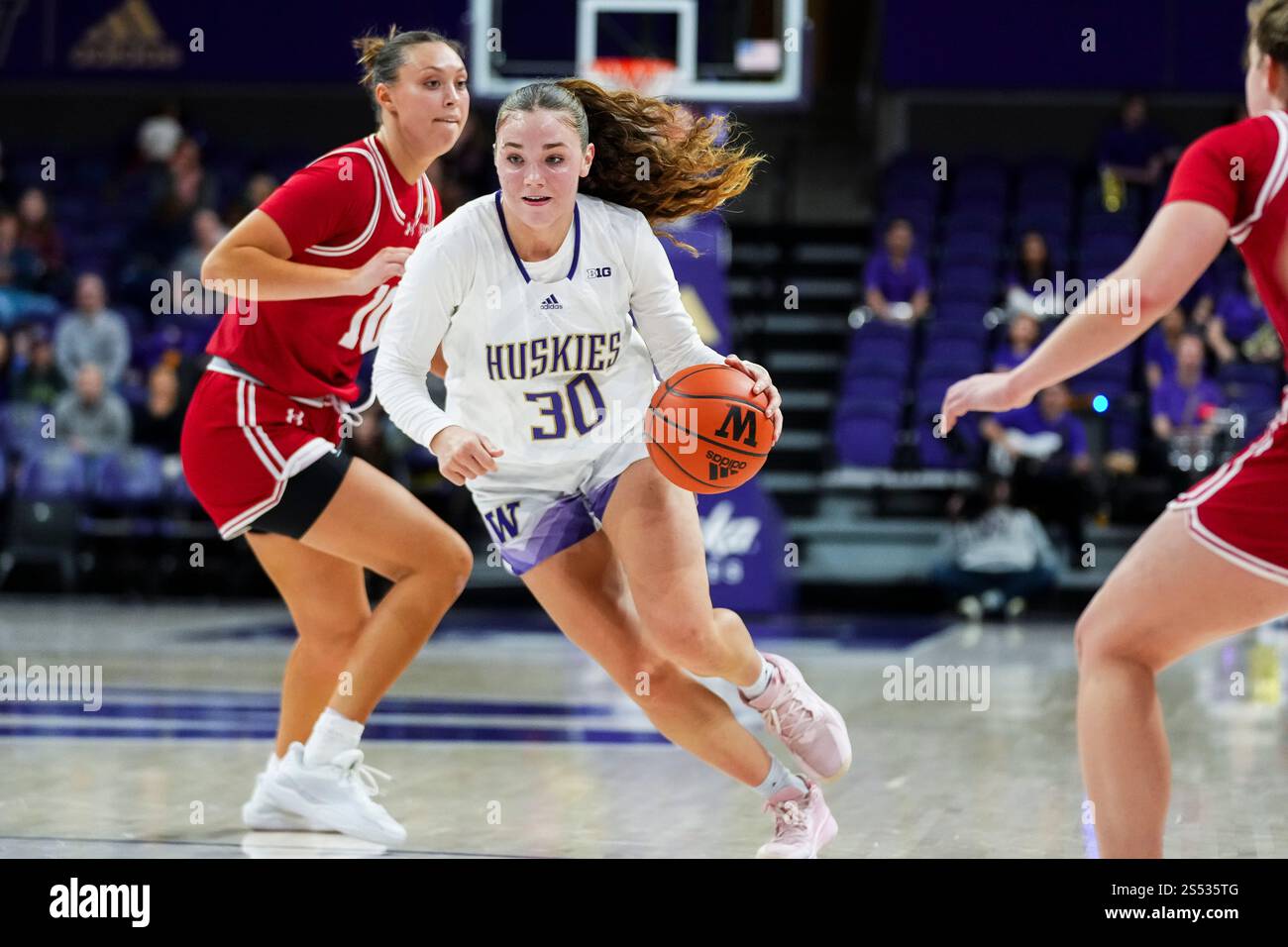 Washington guard Elle Ladine in action against Wisconsin guard Halle ...
