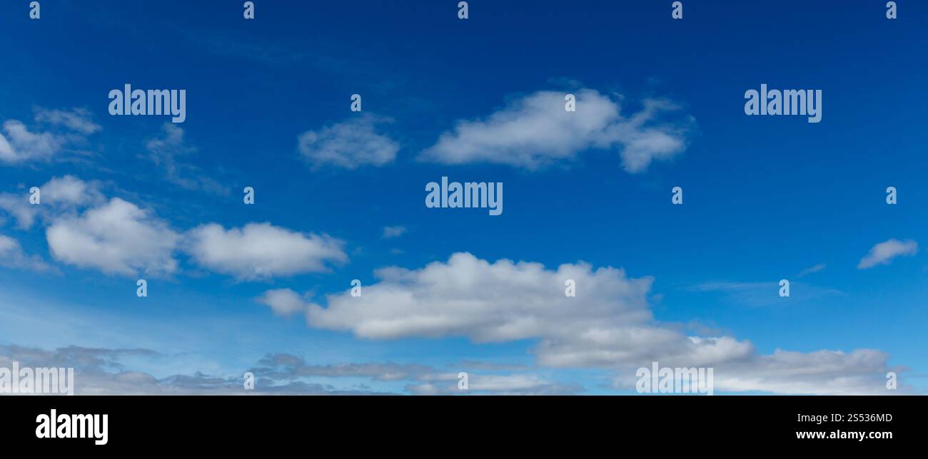 White clouds in the blue azure sky. Summer good weather background ...