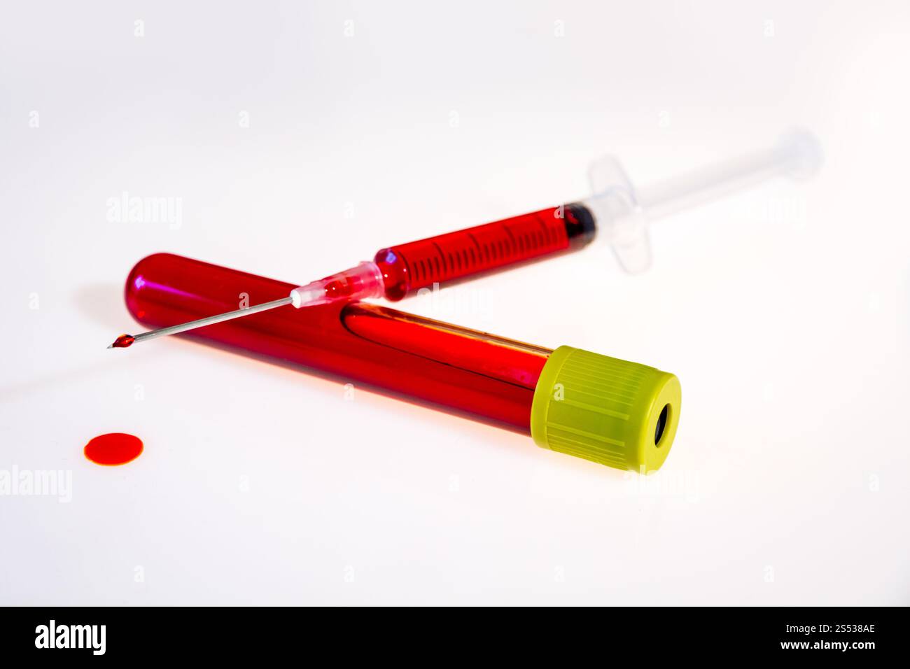 Syringe and test tube with blood isolated on white background. Syringe ...