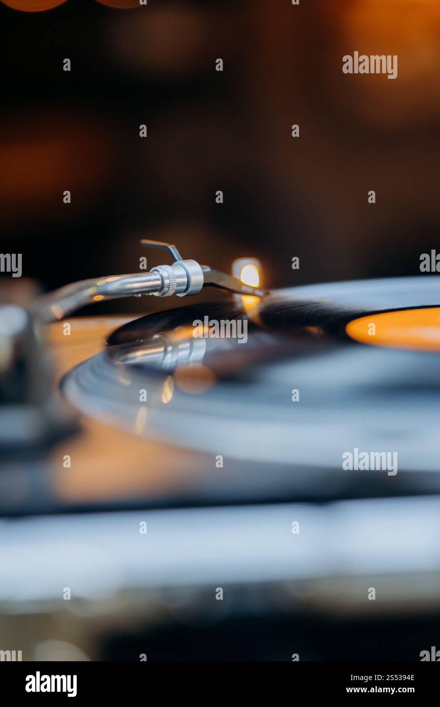 Turntable needle on a spinning vinyl record, evoking vintage charm and ...