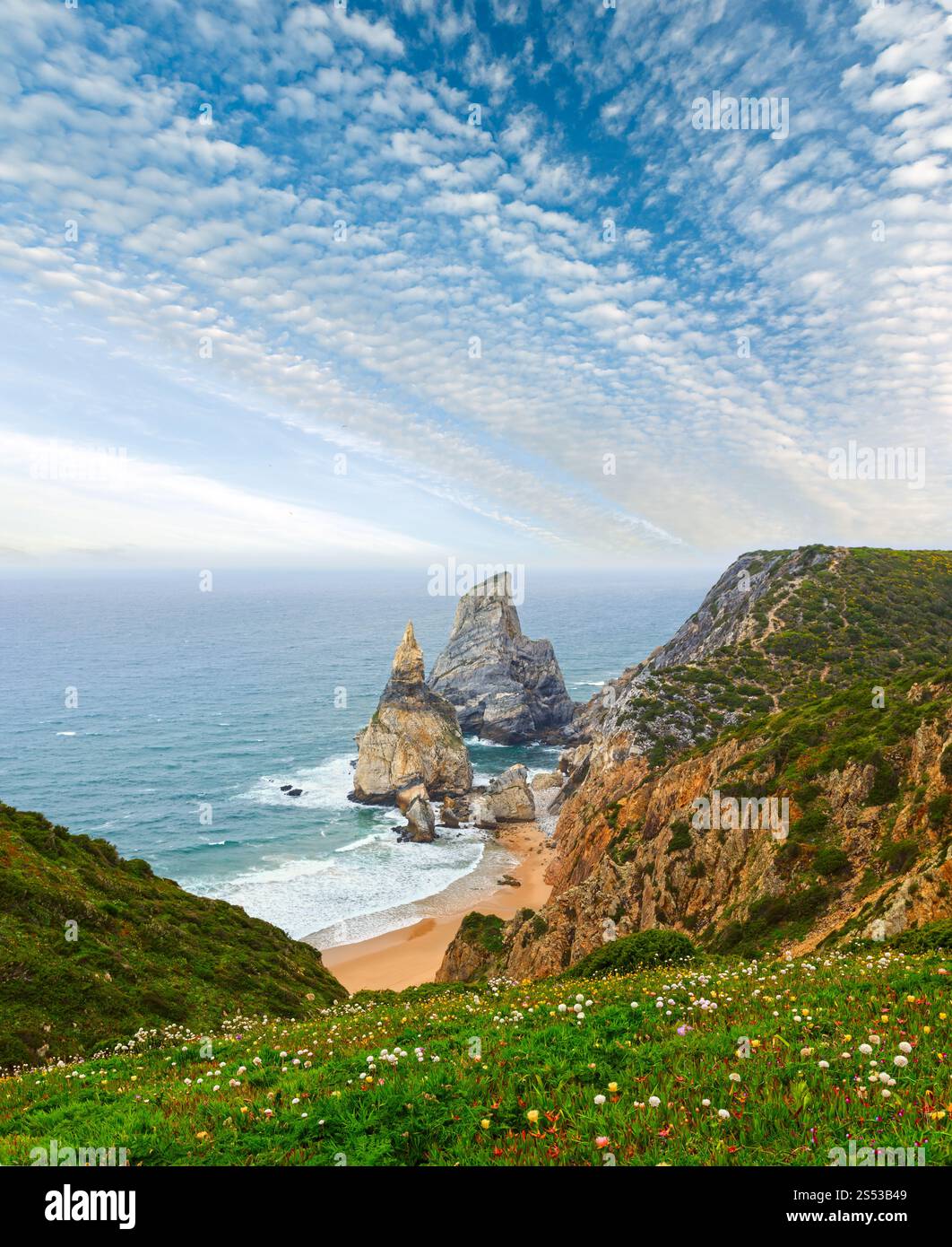Atlantic ocean coast (granite boulders and sea cliffs) in cloudy ...