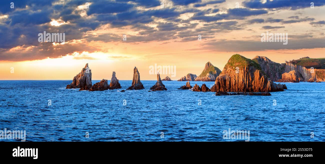 Sharp islets near Gueirua beach, Asturias, Spain. Sunset evening ...