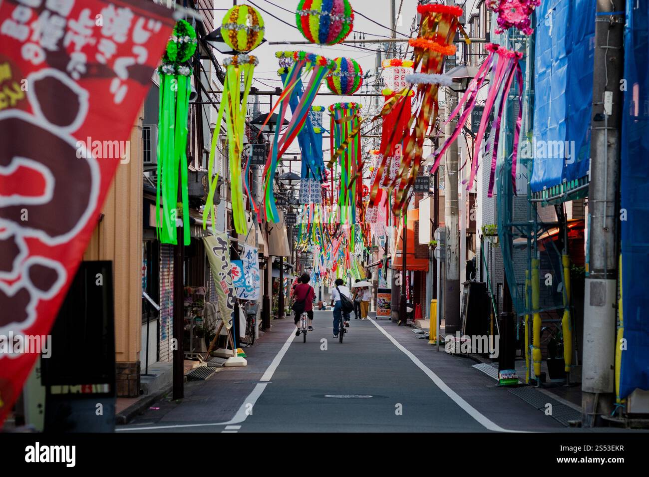small street in tokyo decorated for tanabata (July festival) by paper ...