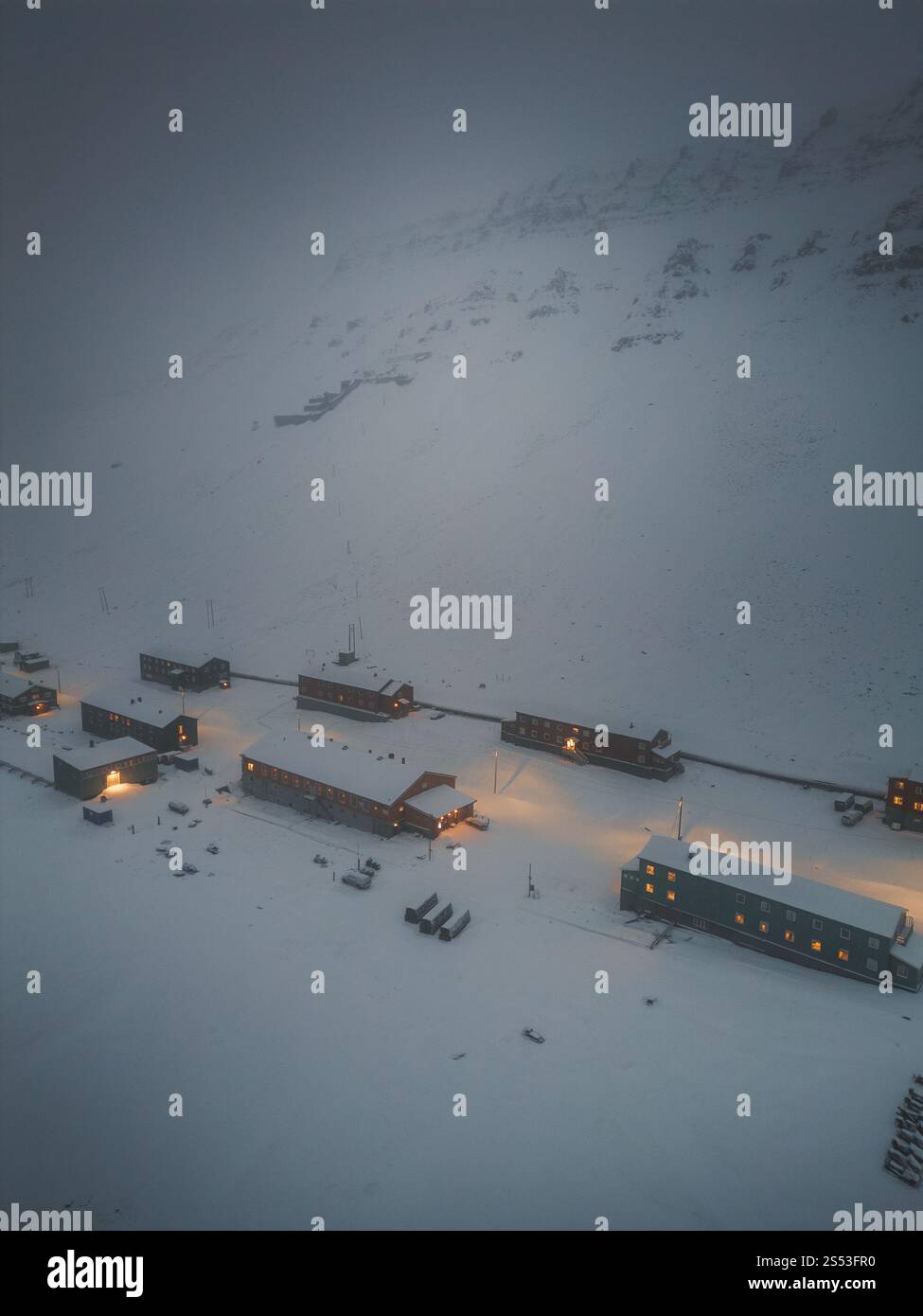 Foggy drone view of Nybyen neighbourhood in Longyearbyen, Svalbard in ...