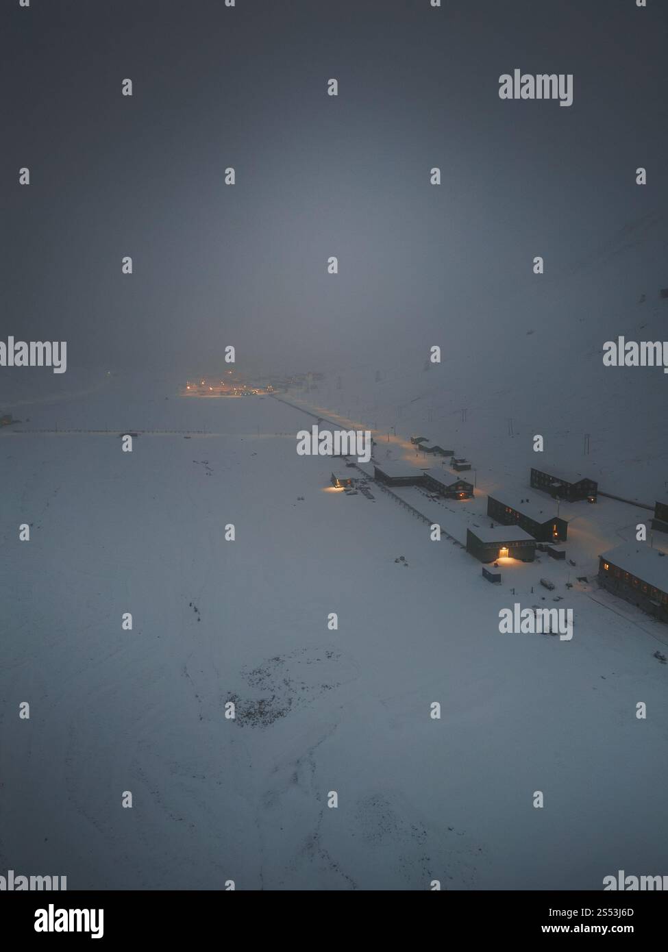 Foggy view of Longyearbyen, Svalbard from Nybyen in winter Stock Photo ...