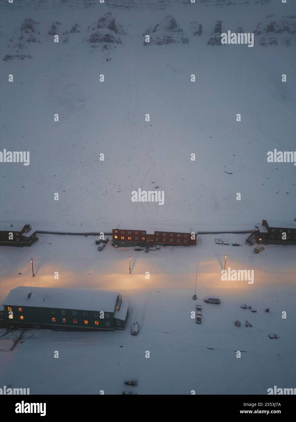 Drone shot of snowy hostel in Nybyen neighbourhood in Longyearbyen ...