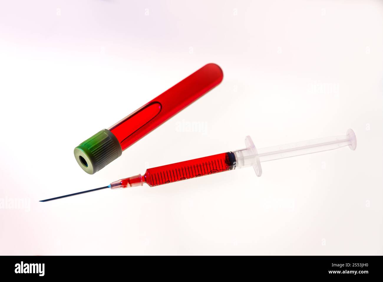 Syringe and test tube with blood isolated on white background. Syringe ...