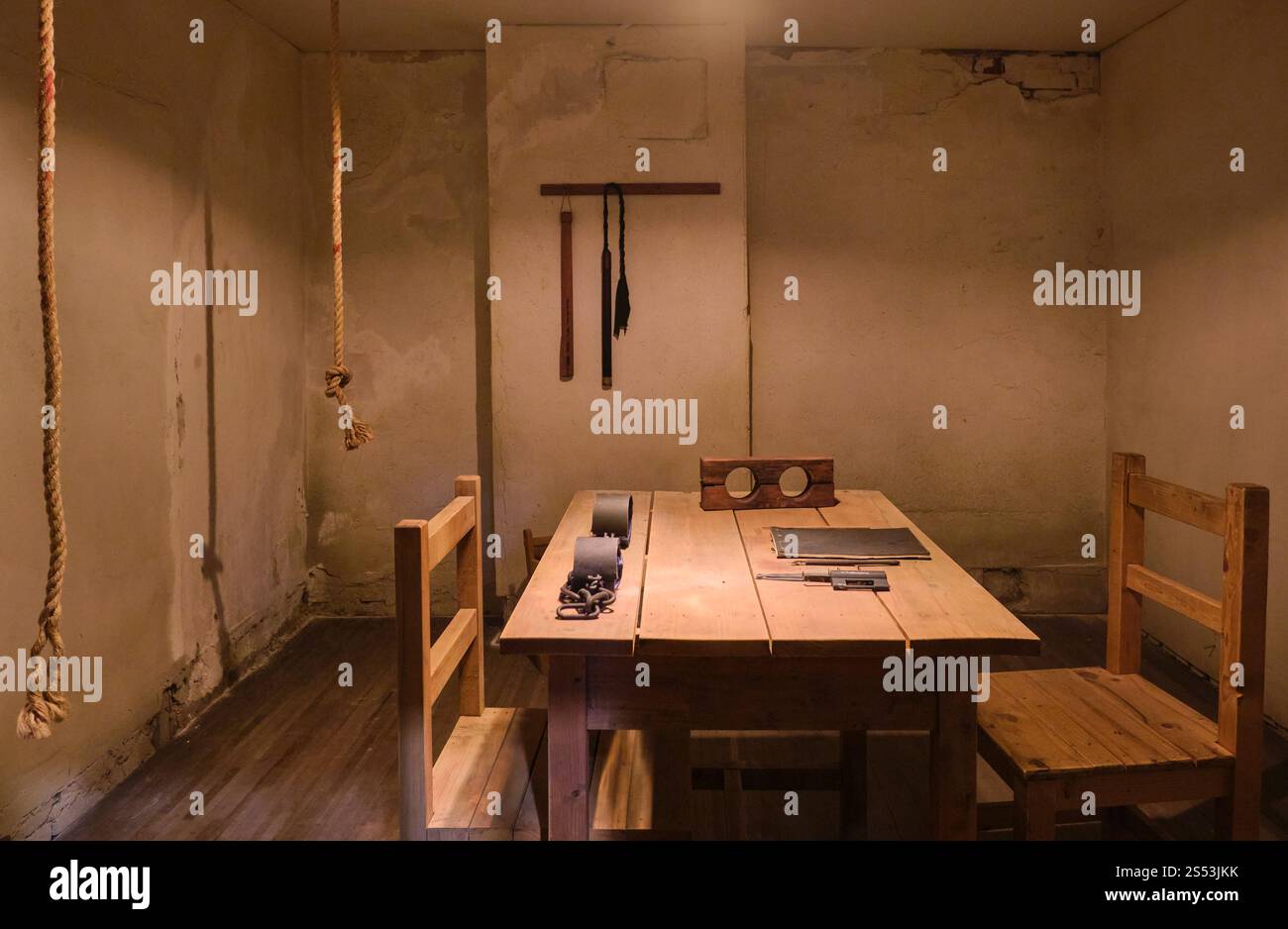 A torture room with clamps, fingernail torture tools, rope and desk. At ...