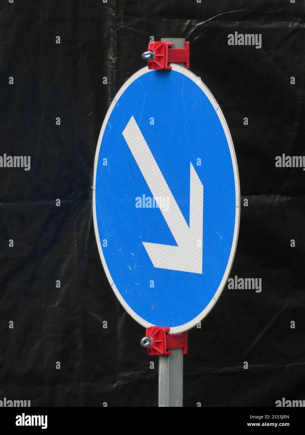 Traffic Sign "Mandatory Traffic Direction" With Arrow Pointing ...