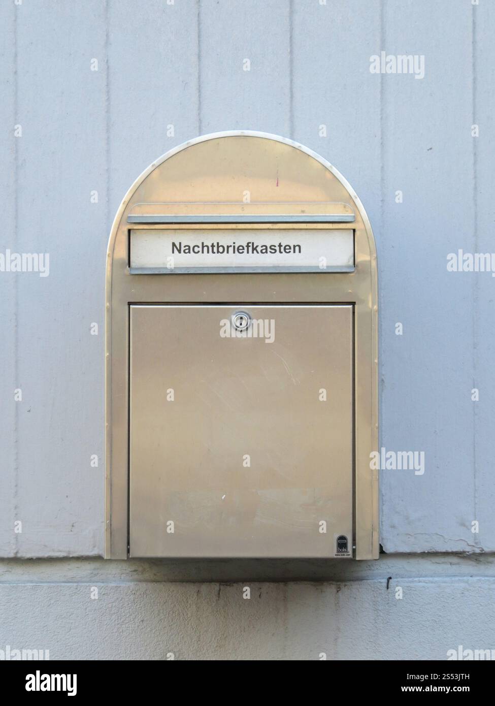 Silver-colored Night Letterbox Attached To A Light-colored House Wall ...