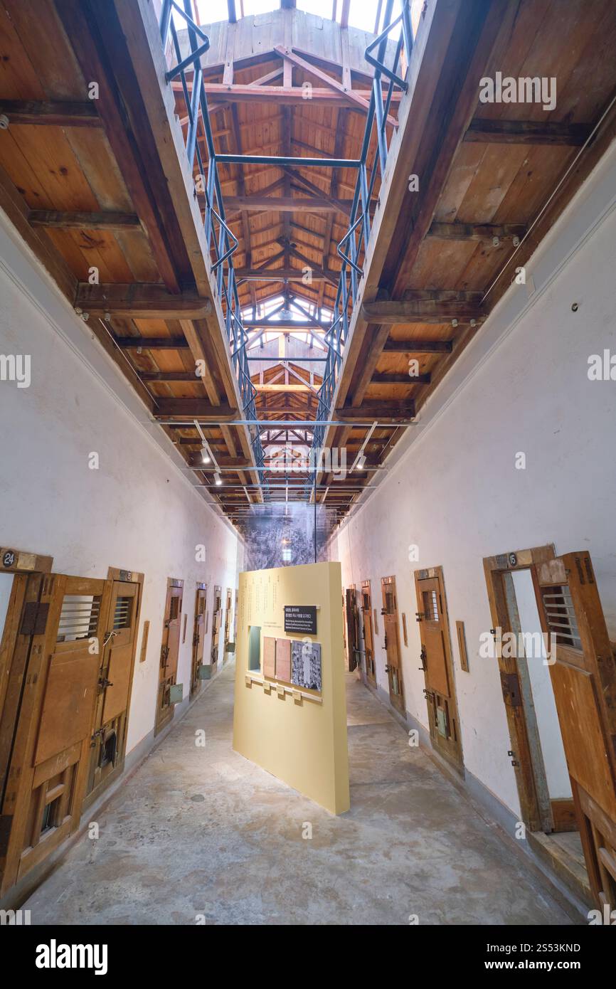View of a typical multistory, catwalk, cell wing with wood doors. At ...