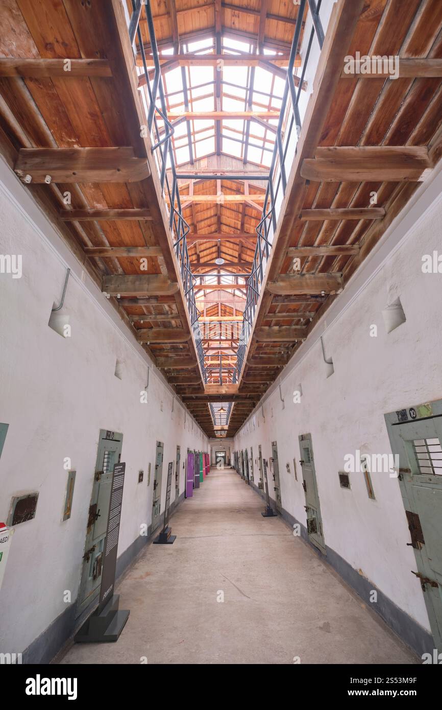 View of a typical multistory, catwalk, cell wing with wood doors. At ...