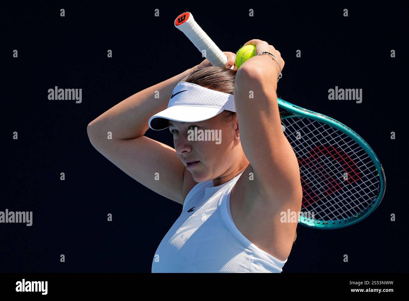 Amanda Anisimova of the U.S. prepares to serve to Maria Lourdes Carle ...