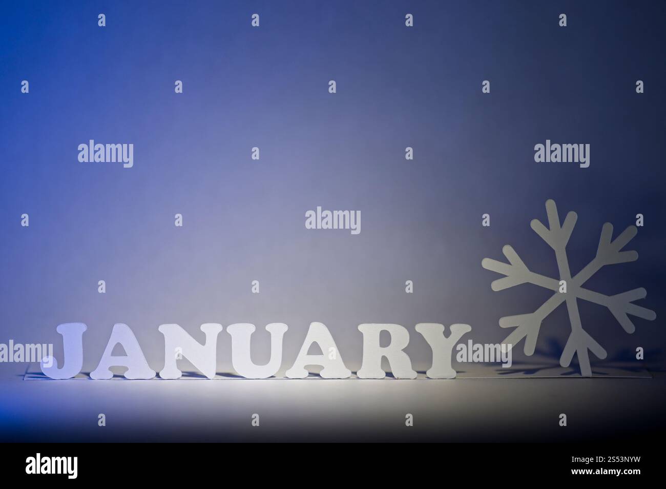 Paper silhouette cutouts of the month of January with a snowflake Stock ...