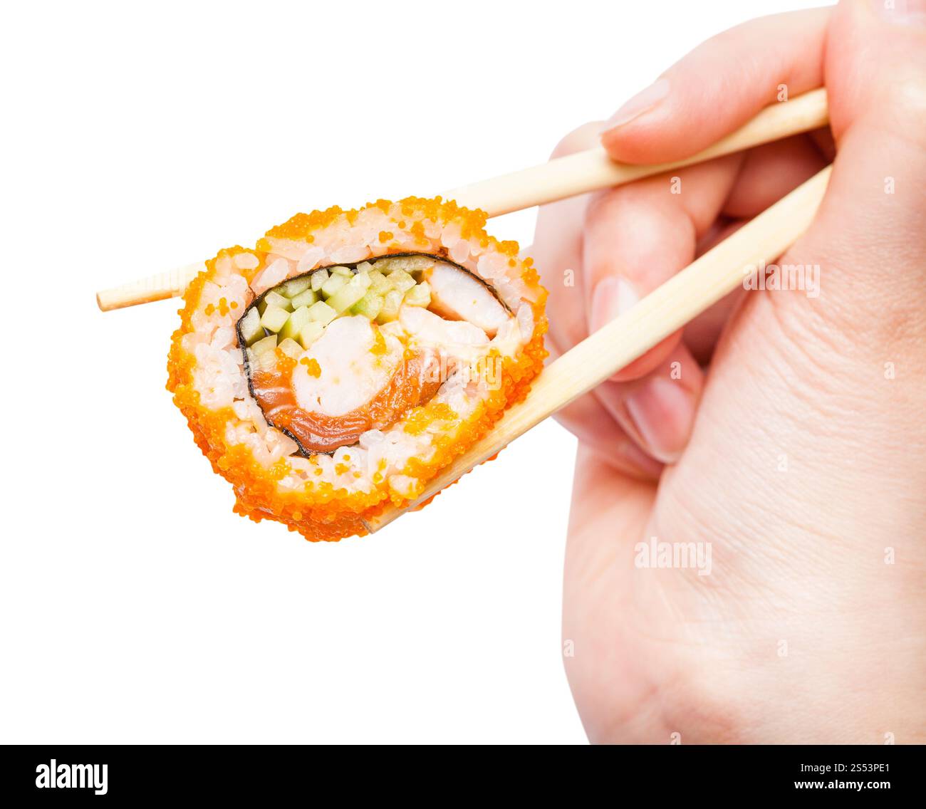 female hand with disposable chopsticks holds california ebi sushi roll ...