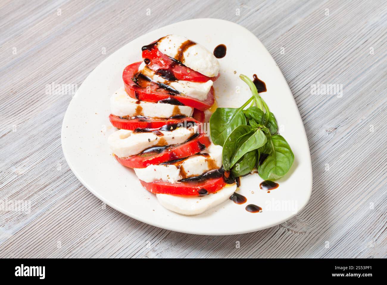 italian cuisine insalata caprese (caprese salad) - sliced mozzarella ...