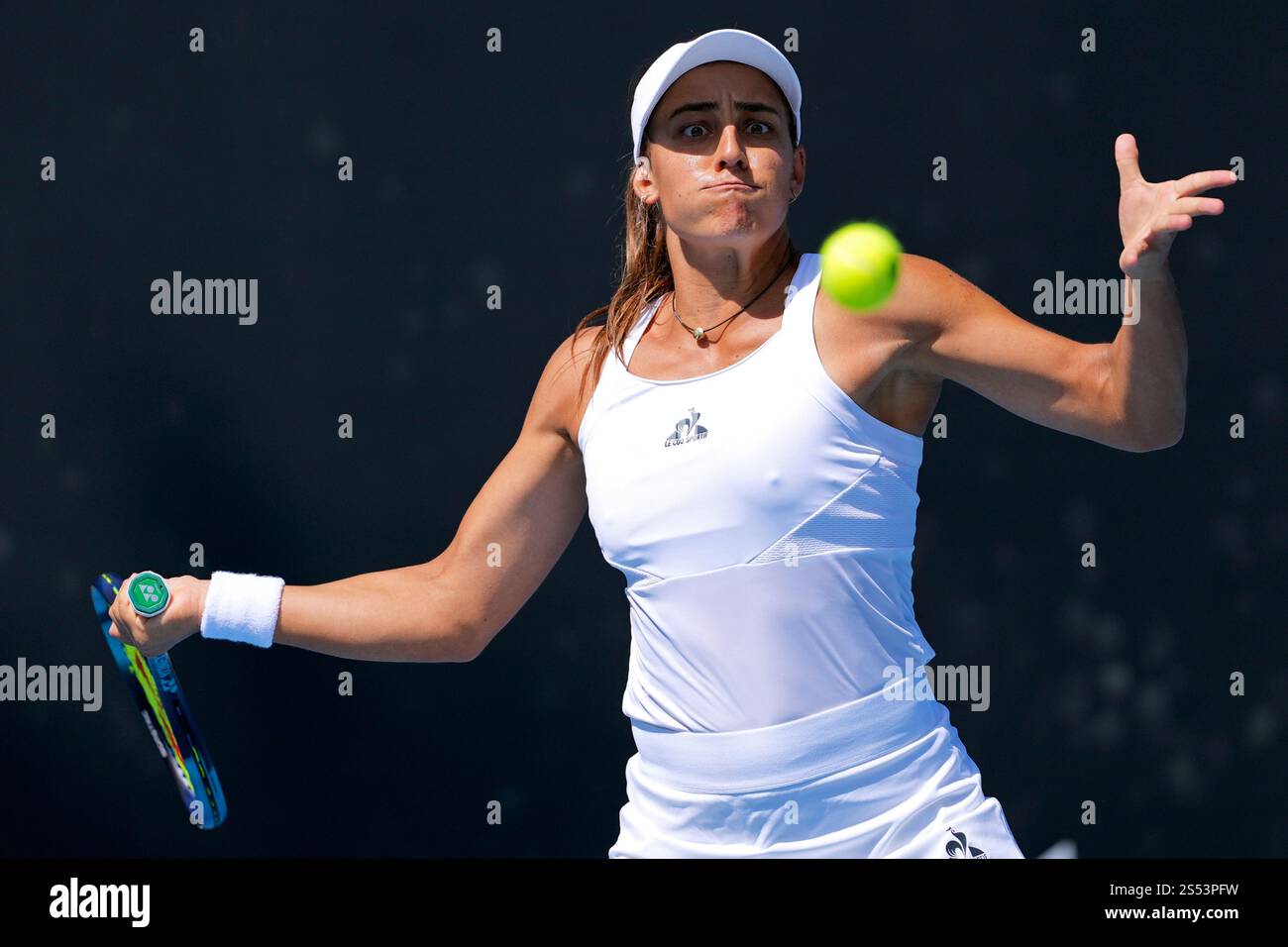 Maria Lourdes Carle of Argentina plays a forehand return to Amanda ...