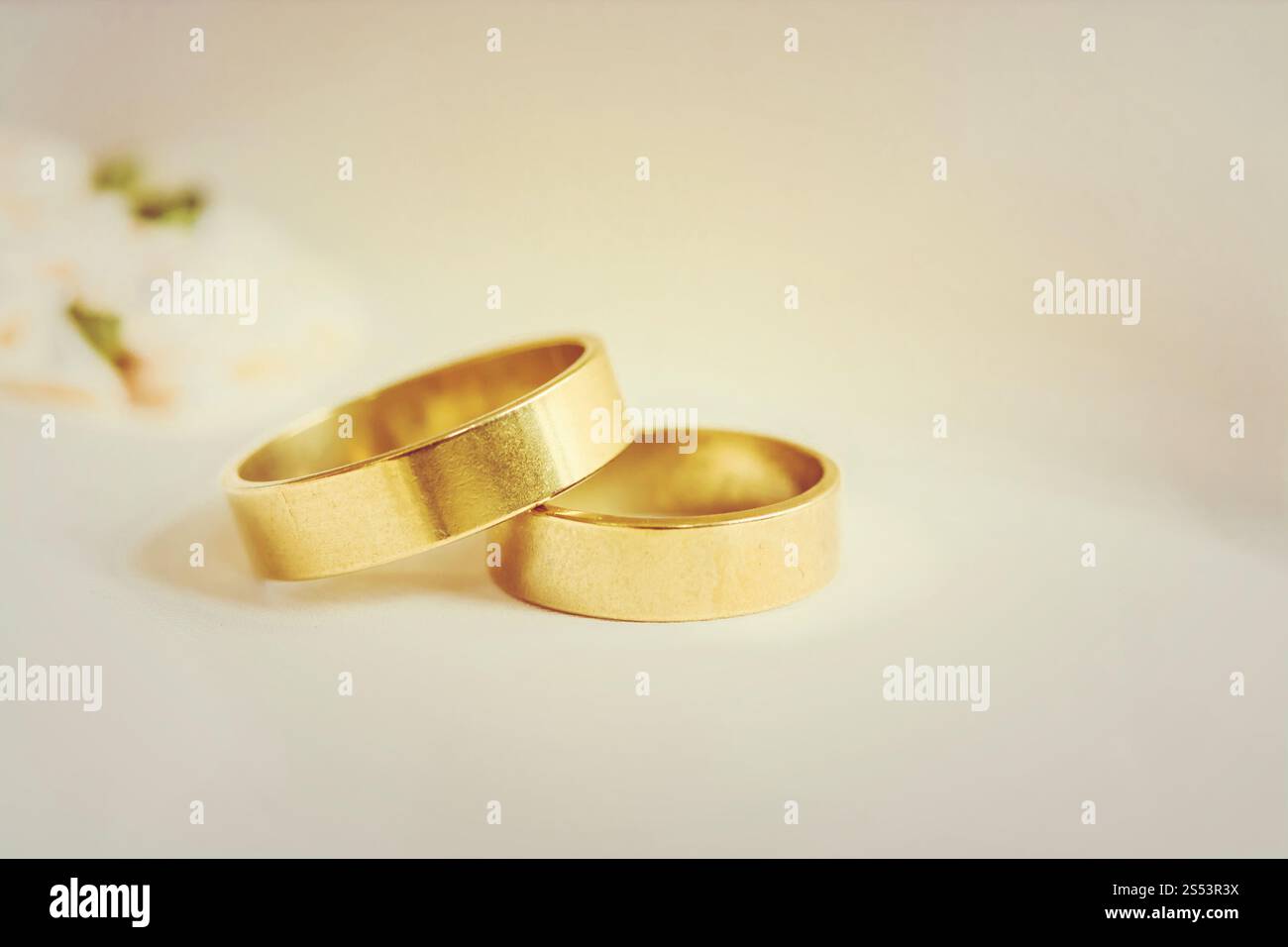 Two wedding rings laying on hi-res stock photography and images - Alamy