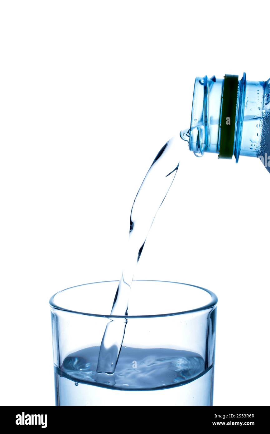 Water pouring from glass bottle Cut Out Stock Images & Pictures - Alamy