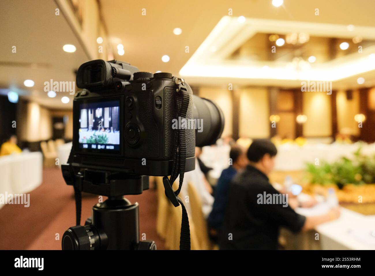 camera in business conference room recording participants and speaker ...
