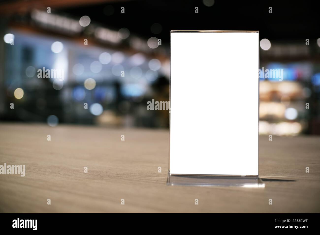 Mock up Menu frame standing on wood table in Bar restaurant cafe. space ...