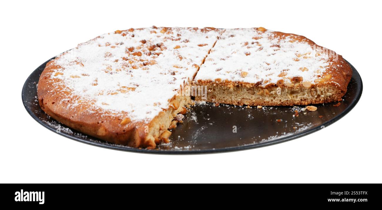 sliced Italian Pine Nut Cake on black plate isolated on white ...