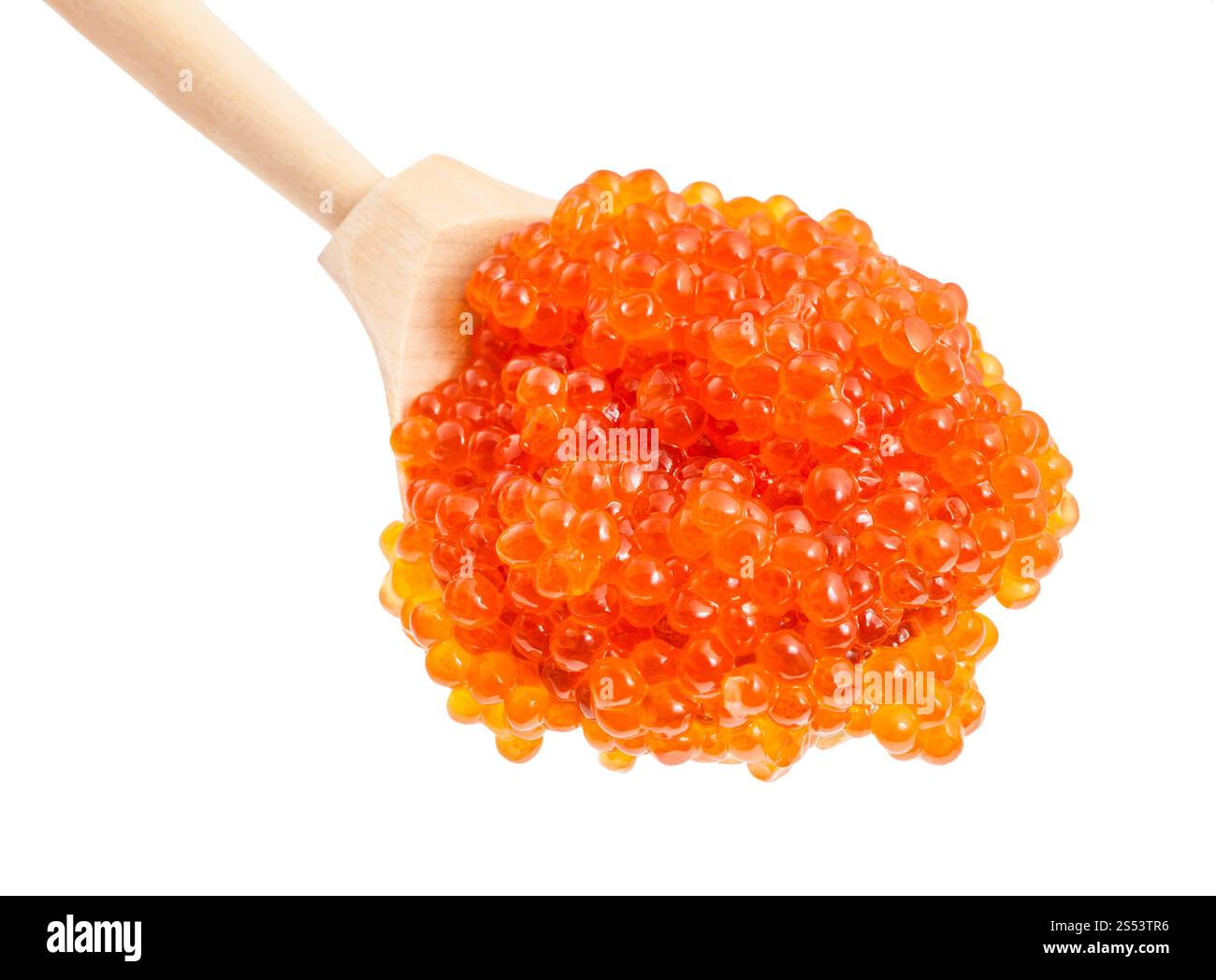 above view of big wooden spoon with salted russian red caviar of pink ...