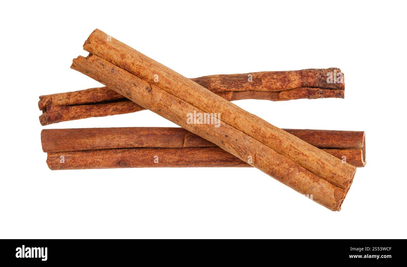three rolled dried Cinnamon sticks isolated on white background Stock ...